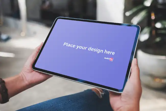 Hands Holding Tablet Mockup Creator | Mokkify